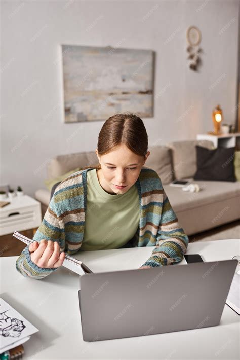 Premium Photo Focused Teen Girl With Notebook Elearning With Laptop