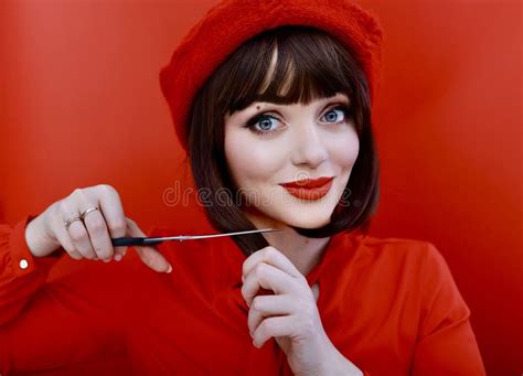 Portrait Of A Girl In Glasses With Scissors In Her Hands Stock Image