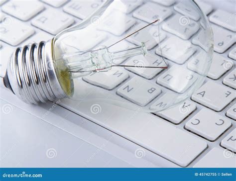 Light Bulb And Computer Keyboard Stock Image Image Of Lightbulb Laptop