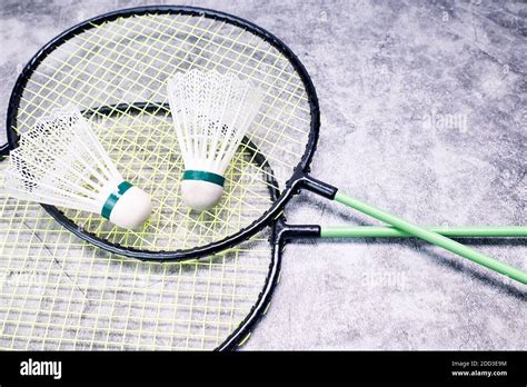 Two Shuttle Cock Badminton And Two Racket Indoor Sports Concept Stock