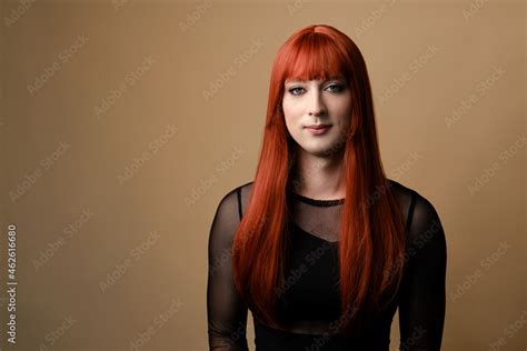 Transsexual Woman Portrait Of Young Transgender Woman In A Red Wig And