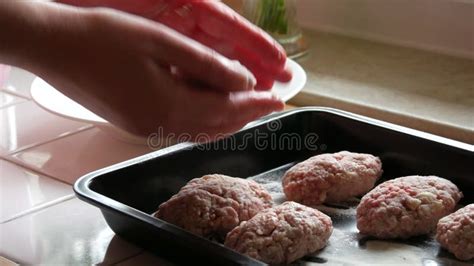 A Woman Makes Homemade Meatballs Or Cutlets From Minced Meat Dips Them In Flour And Shapes Them