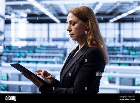 Data Center Software Developer Ensuring Safety And Security Of Database Using Tablet