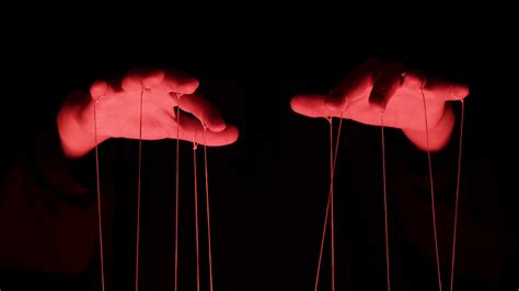 Hands Of Puppeteer Controlling Puppets In Stock Footage SBV 348956121