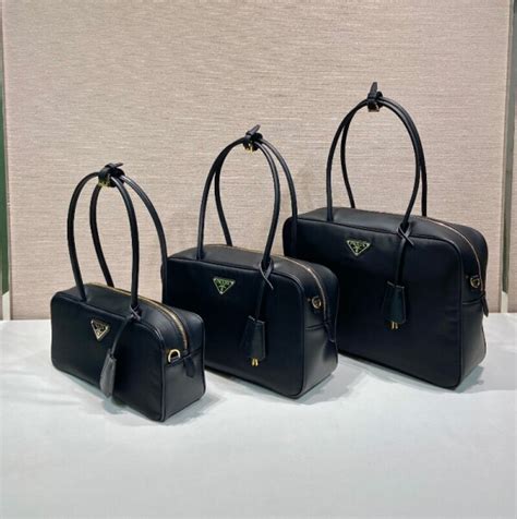 프라다 스몰 리나일론 가죽 탑핸들 백 블랙 1bb133 위핑