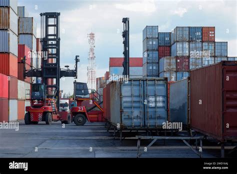 Container Shipping Site Loading And Unloading By Crane In The Port Logistics Warehouses