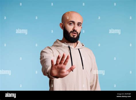 Confident Arab Man Making Stop Gesture Stock Photo Alamy
