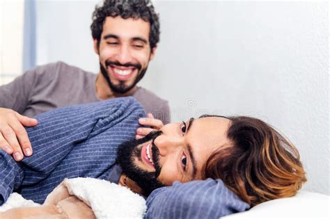 Male Couple Relaxing At Bed And Smiling Happy Stock Image Image Of Happy Family