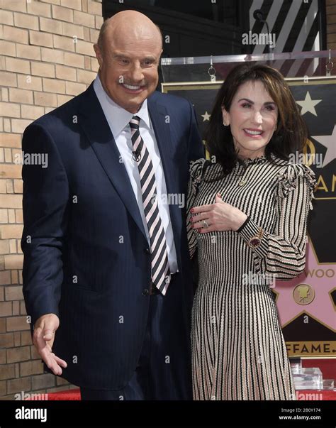 L R Dr Phil Mcgraw And Wife Robin Mcgraw At His Star On The Hollywood Walk Of Fame Ceremony