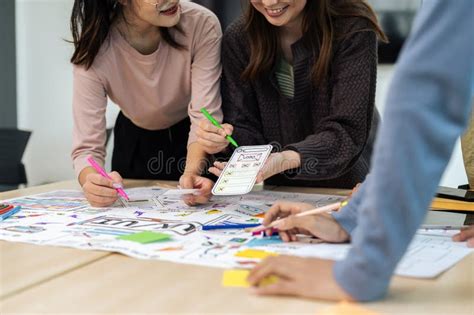 Team Of Ux Developer And Ui Designer Brainstorming Interface Wireframe Design Creative Digital