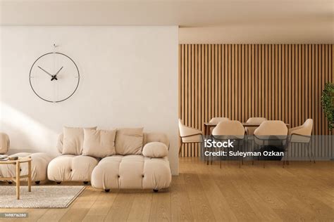 소파와 안락의자가 있는 현대적인 거실 인테리어 책과 장식이 있는 커피 테이블 단단한 나무 바닥에 깔린 카펫 의자가 있는 식탁