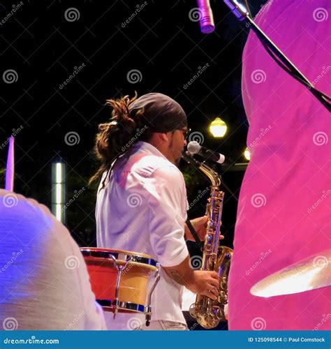 Saxophone Player Performing Outdoors At Night Editorial Stock Image Image Of Downtown Player