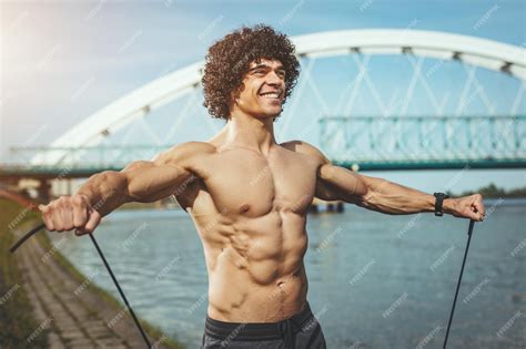 Premium Photo Fit Muscular Young Man With Naked Torso Doing Exercise
