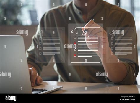 Man Chooses Questionnaire With Checkbox Survey Form Online Answer Questions In The Exam Of