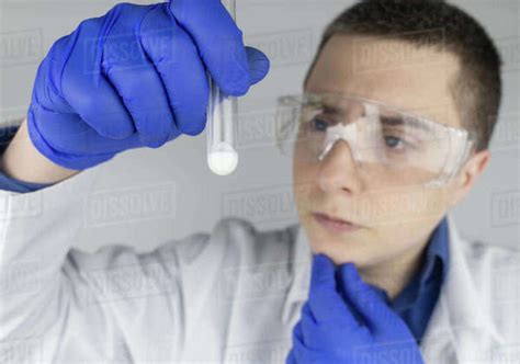 Medical Laboratory Assistant Checks A Test Tube With Sperm Spermogram Male Fertility Test