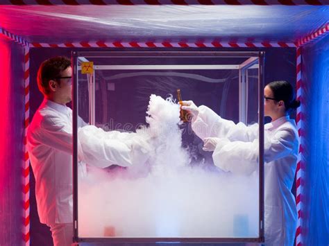 Two Scientists Conducting Tests In Sterile Chamber Stock Photo Image Of Goggles Chemist 31952804
