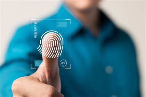 A Man Is Pressing A Fingerprint On A Glass Screen With The Finger Print In Front Of Him