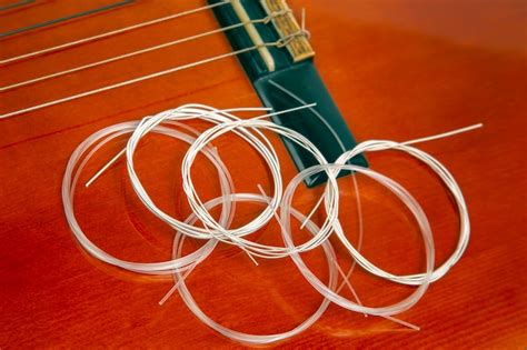 Premium Photo New Nylon Strings For Classical Guitar Lie On Guitar