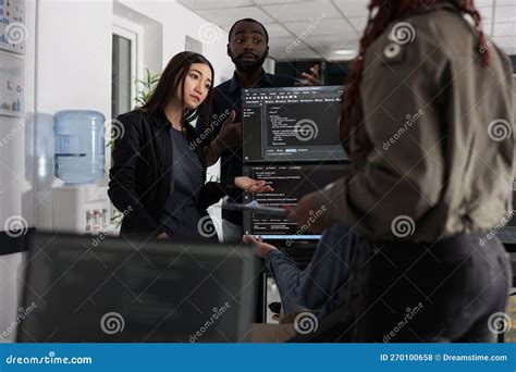 software engineers collaborating on coding project talking about