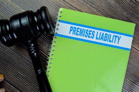 Concept Of Premises Liability Write On Book With Gavel Isolated On Wooden Table Stock Image
