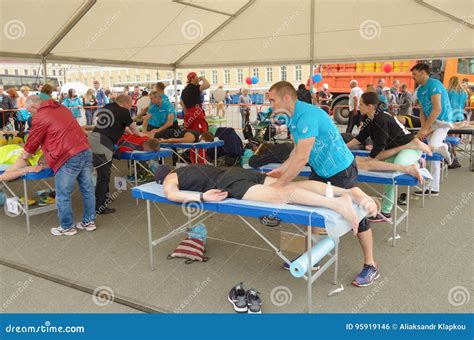 Sports Massage Massage Therapist Massaging Shoulders And Legs Of Athletes Working With