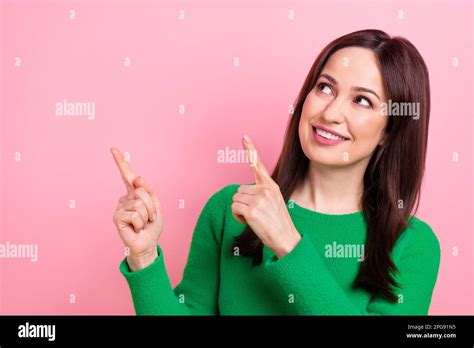 Photo Of Positive Dreamy Woman Wear Green Sweater Showing Two Fingers