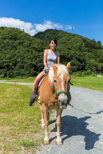 Premium Photo Woman Riding A Horse