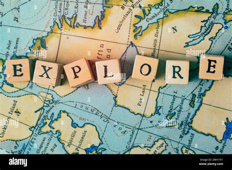 Explore Word Written In Wooden Blocks On A Vintage Travel Map Stock