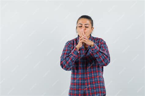 Free Photo Lady In Casual Shirt Blowing On Finger Pistol And Looking