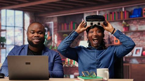 Woman Interacts With Vr While Her Boyfriend Completes The 3d Animation