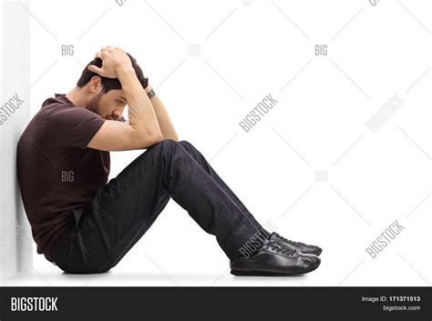 Man Sitting On Floor