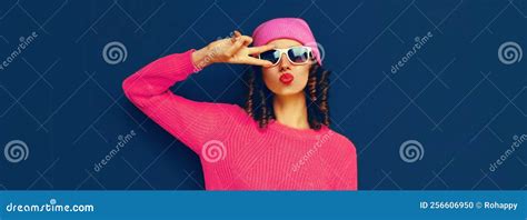 Portrait Of Stylish Modern Young Woman Blowing Her Lips Sending Sweet