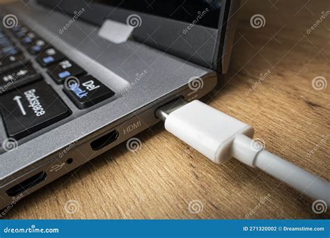 Cable USB Adapter Under The Type C Connector Is Installed In Laptop Against The Background Of A