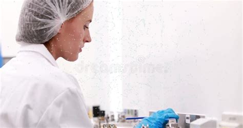 In Lab Scientist In Lab Coat And Hairnet Working With Animation Overlay Stock Video Video Of