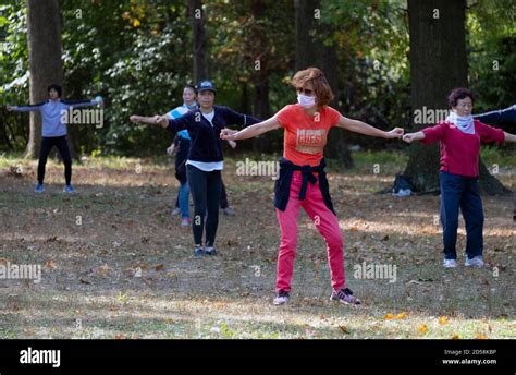 Asian American Women At A Dance Exercise Class In A Park In Flushing
