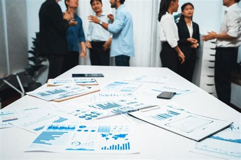 Premium Photo Analyzed Financial Data Visualized Papers On Meeting Table Prudent