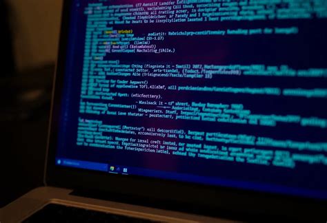 laptop screen displaying arbitrary code hackernoon