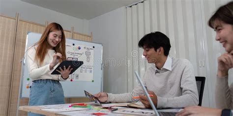 Ux Developer And Ui Designer Presenting Mobile App Interface Design On Whiteboard In Meeting At