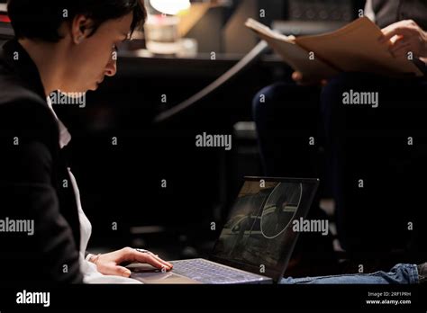 Investigator Being Tired After Working Late At Night At Criminal Investigation Analyzing