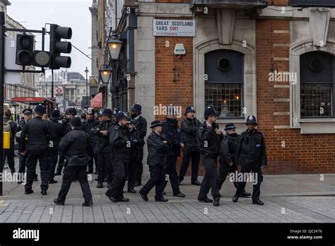 Group Of Metropolitan Police Officers Gathered On Great Scotland Yard