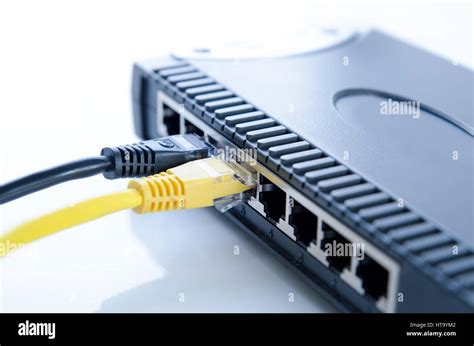 Network Switch Device And Ethernet Cables On White Background Stock Photo Alamy