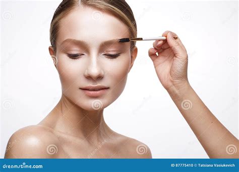 Young Girl With A Healthy Skin And Nude Makeup Beautiful Model On