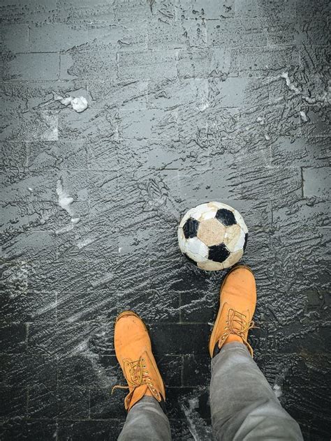 First Person Point Of View Down On The Man Feet Wearing Yellow Boots
