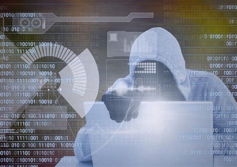 Hacker With Hood Holding A Credit Card And Using A Laptop In Frond Of