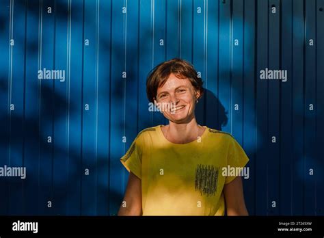 Joyful Young Brunette Woman Girl In Light Casual Clothes Posing On Blue Wall Background People