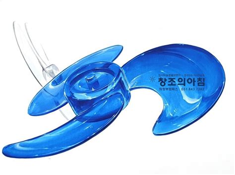 A Blue Glass Sculpture Is Shown On A White Background