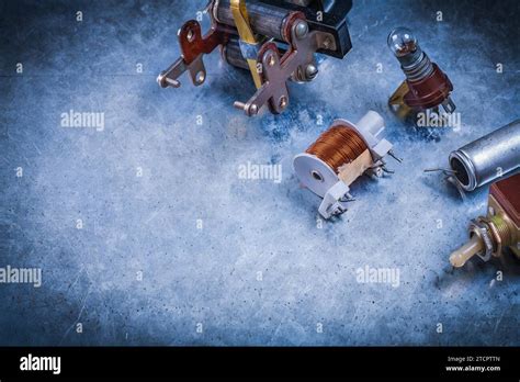 Electrical Capacitor Resistor Transformer Lamp Socket Toggle Switch On Scratched Metallic