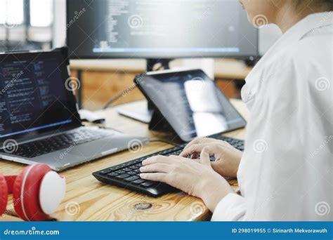 it programmer starts working on desktop computer stock image image