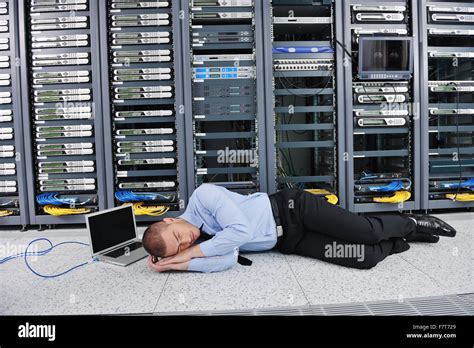 It Business Man In Network Server Room Have Problems And Looking For Disaster Situation Solution