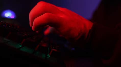 Close Up Unrecognizable Man Using A Computer Keyboard To Code A Close Up Unrecognizable Man Using A Computer Keyboard To Code A